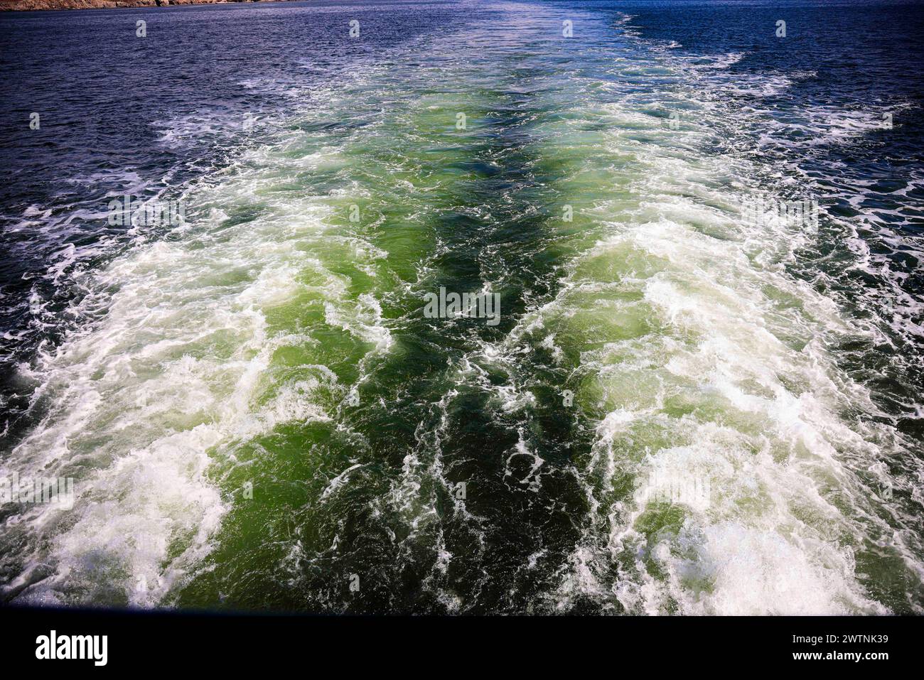 Wake in the sea Behind Big ship, prop wash of a tanker underway in open ...