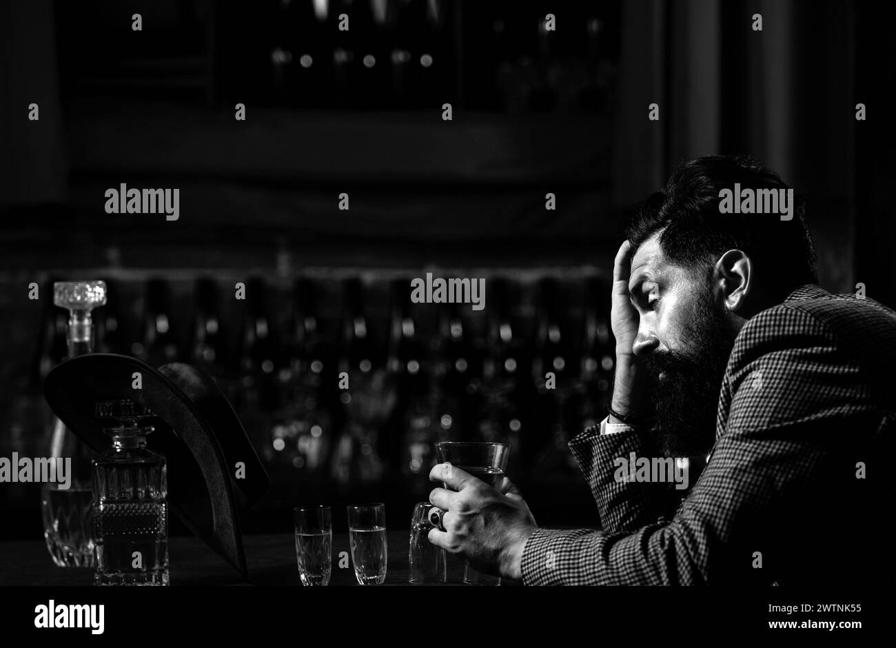Bad habit, alcohol addiction. Handsome bearded man enjoying whiskey in ...