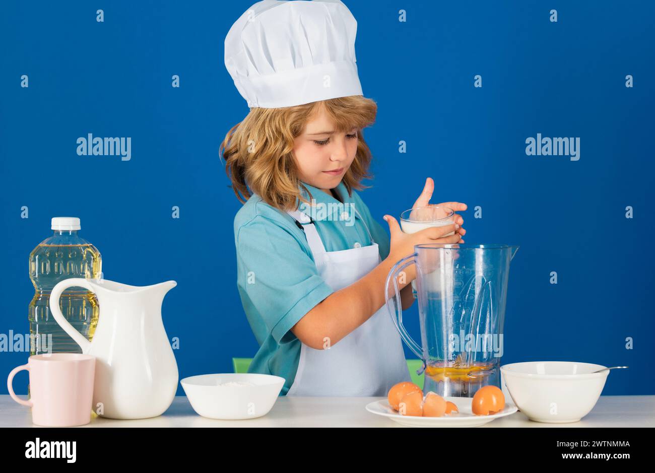 Cooking children. Chef kid boy making fresh vegetables for healthy eat ...