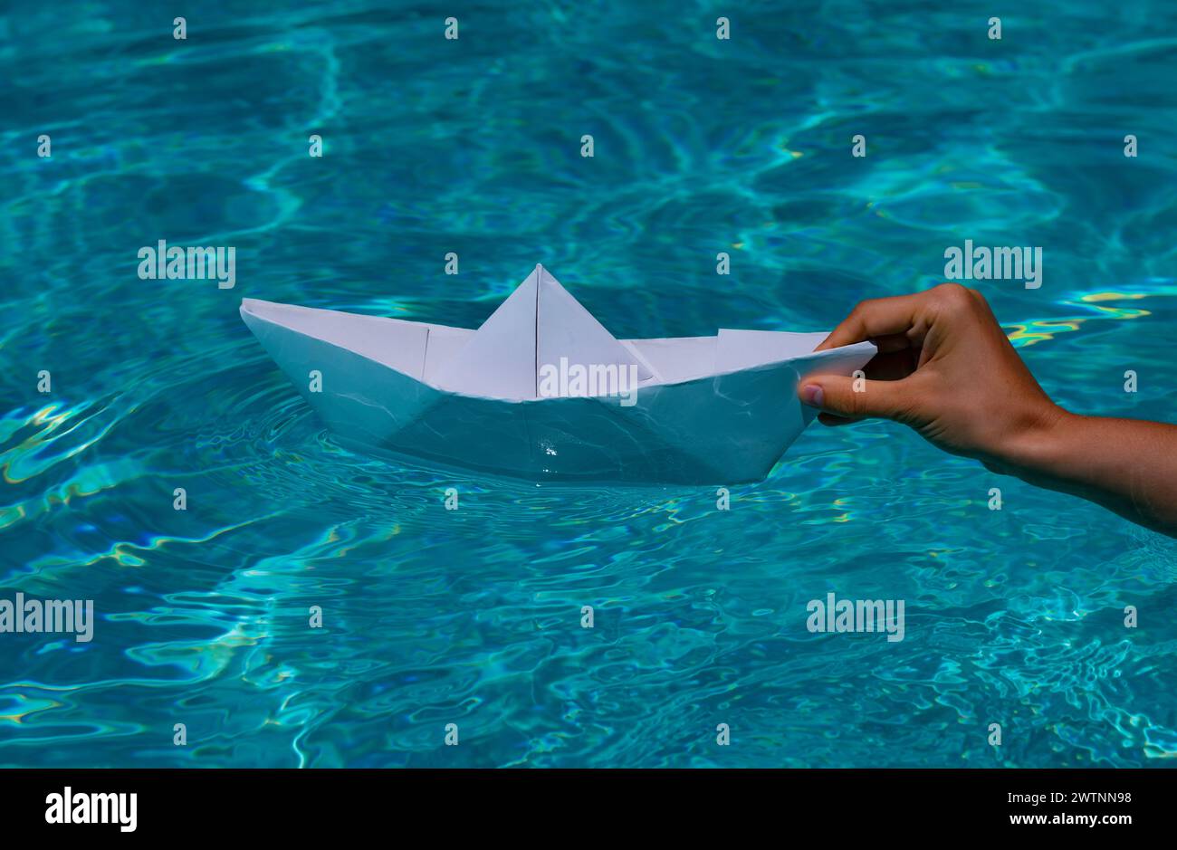 Paper ship in hand. Hand and paper boat. Origami paper boat Stock Photo ...