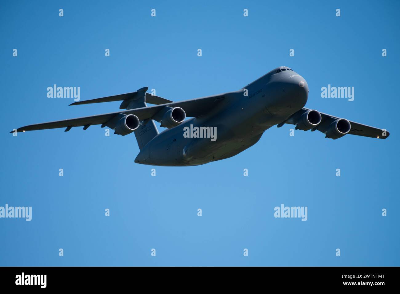 A U.S. Air Force C-5M Super Galaxy flies overhead as part of the ...