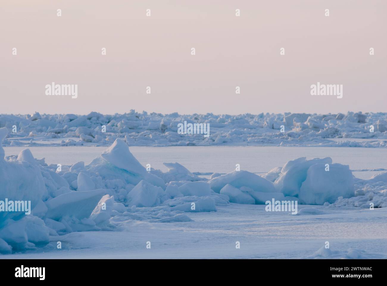 Seascape of rough pack ice over the Chukchi sea in springtime, off shore from the arctic village ...