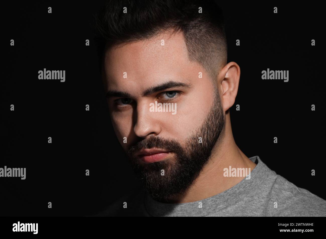 Evil eye. Man with scary eyes on black background Stock Photo - Alamy