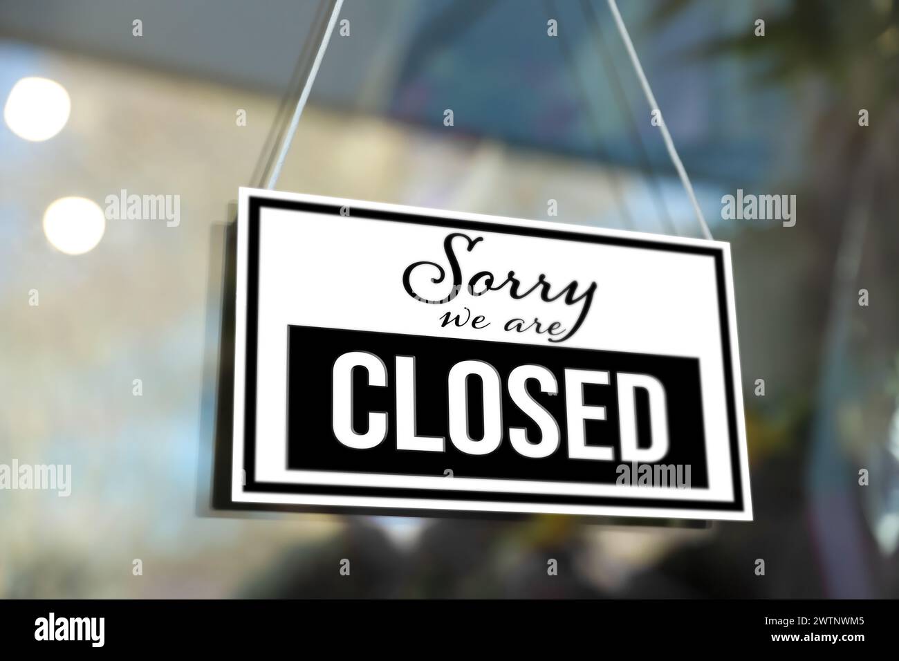 Sorry we are closed sign hanging on glass door Stock Photo - Alamy