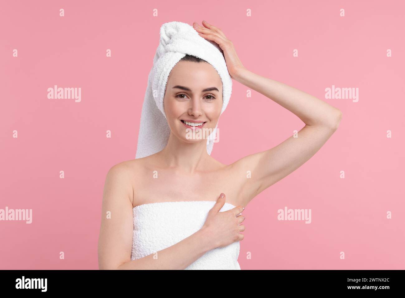 Beautiful woman showing armpit with smooth clean skin on pink ...