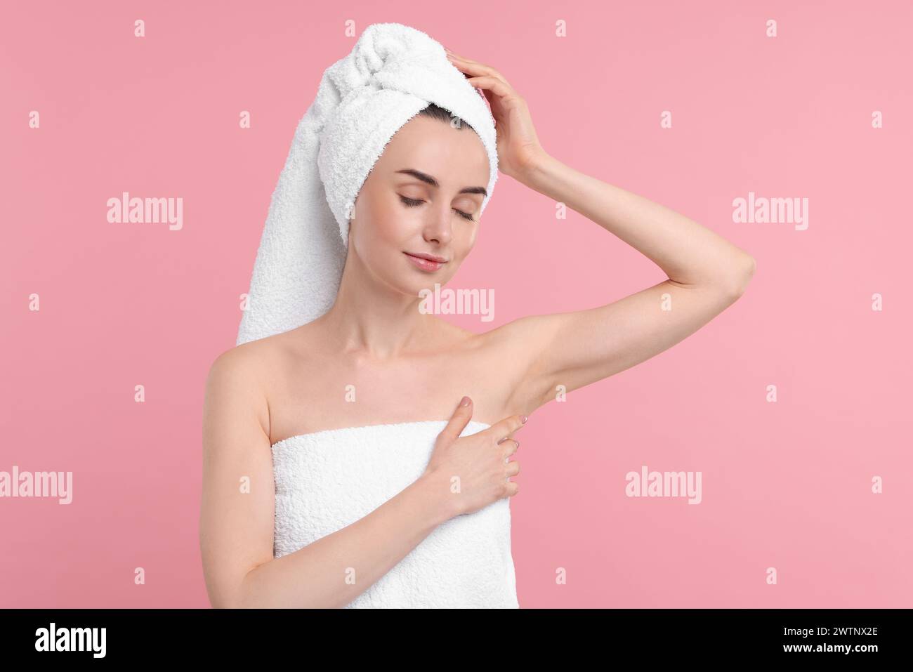 Beautiful woman showing armpit with smooth clean skin on pink ...
