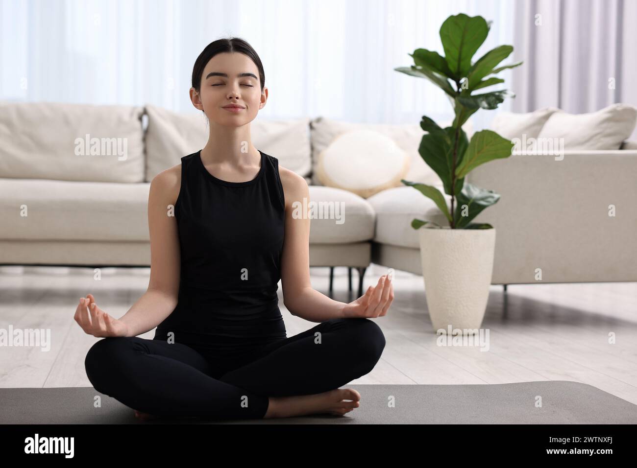 Caucasian teen girl meditating hi-res stock photography and images - Alamy