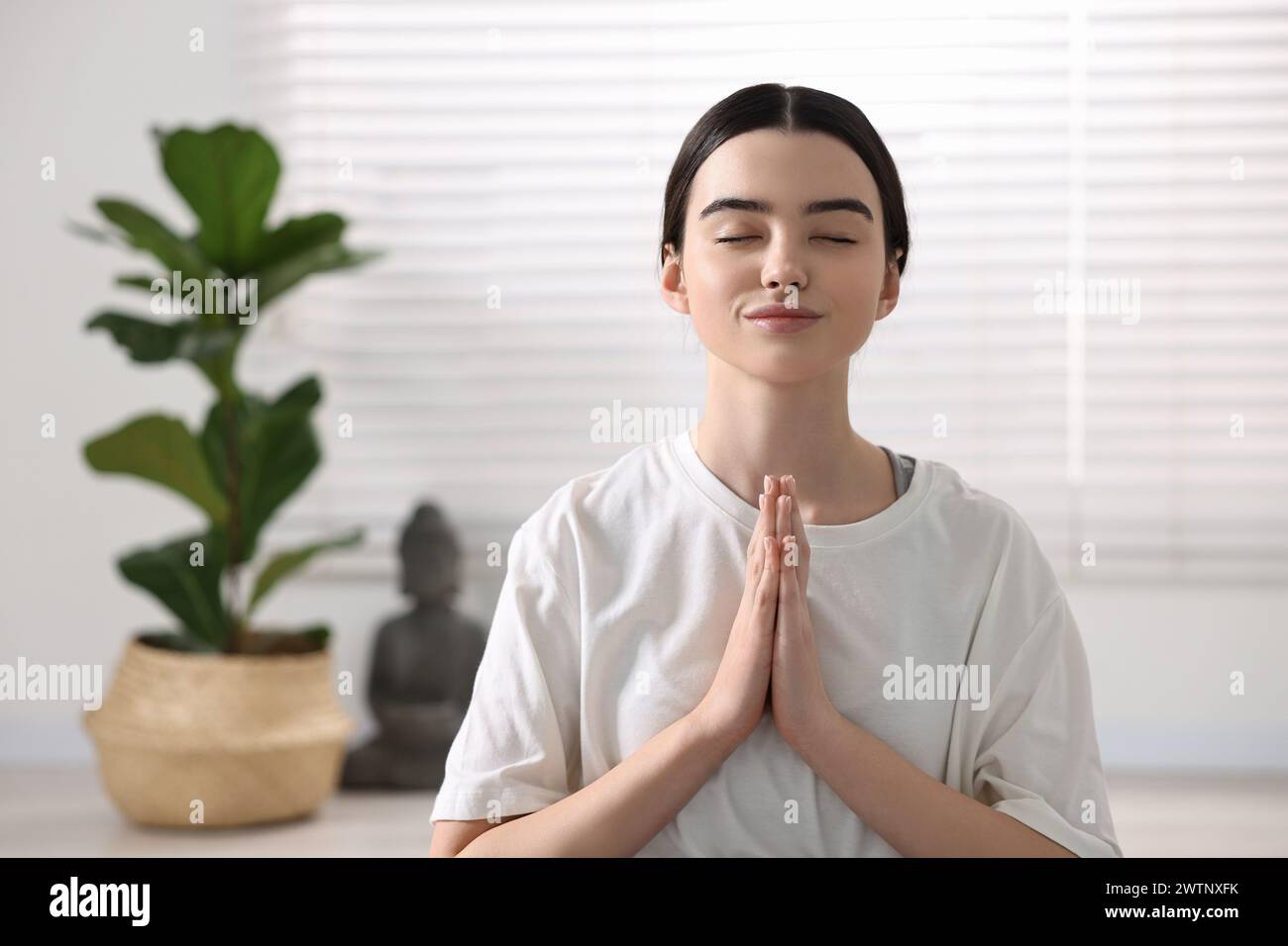 Caucasian teen girl meditating hi-res stock photography and images - Alamy