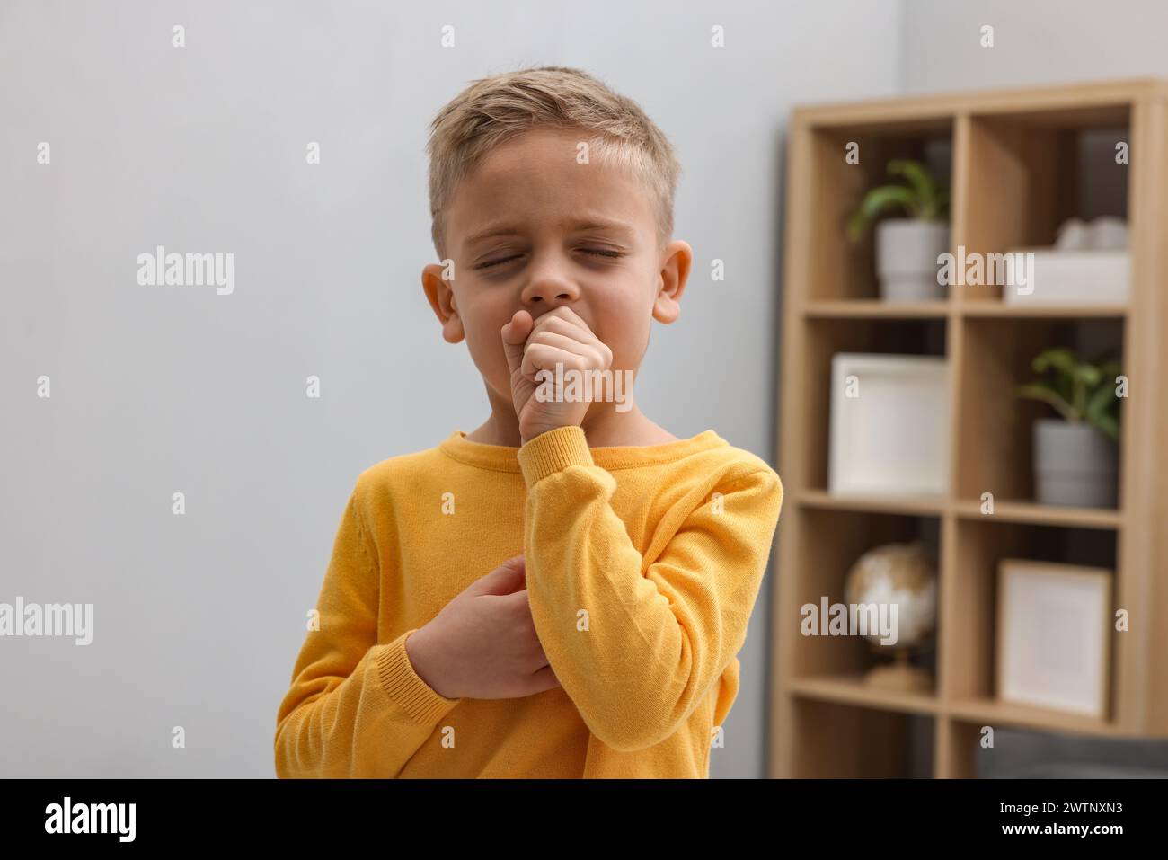 Sick boy coughing at home. Cold symptoms Stock Photo - Alamy