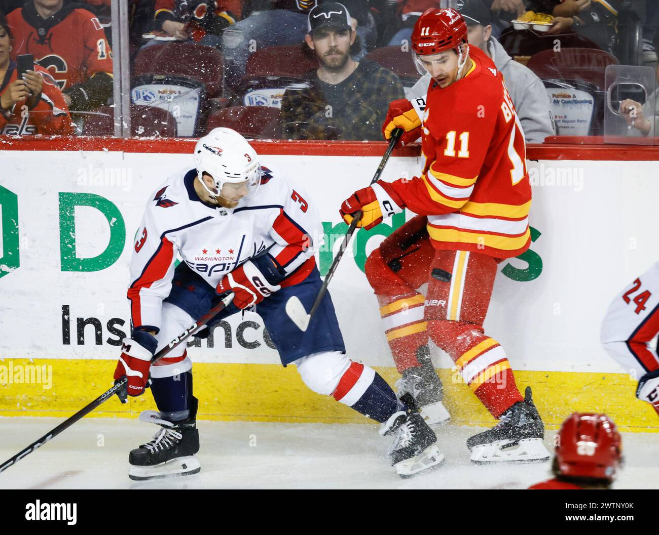 Washington Capitals defenseman Nick Jensen (3) and Calgary Flames ...