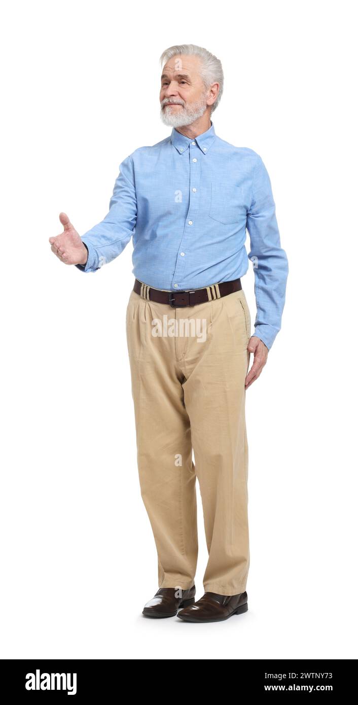 Senior man greeting someone on white background Stock Photo - Alamy