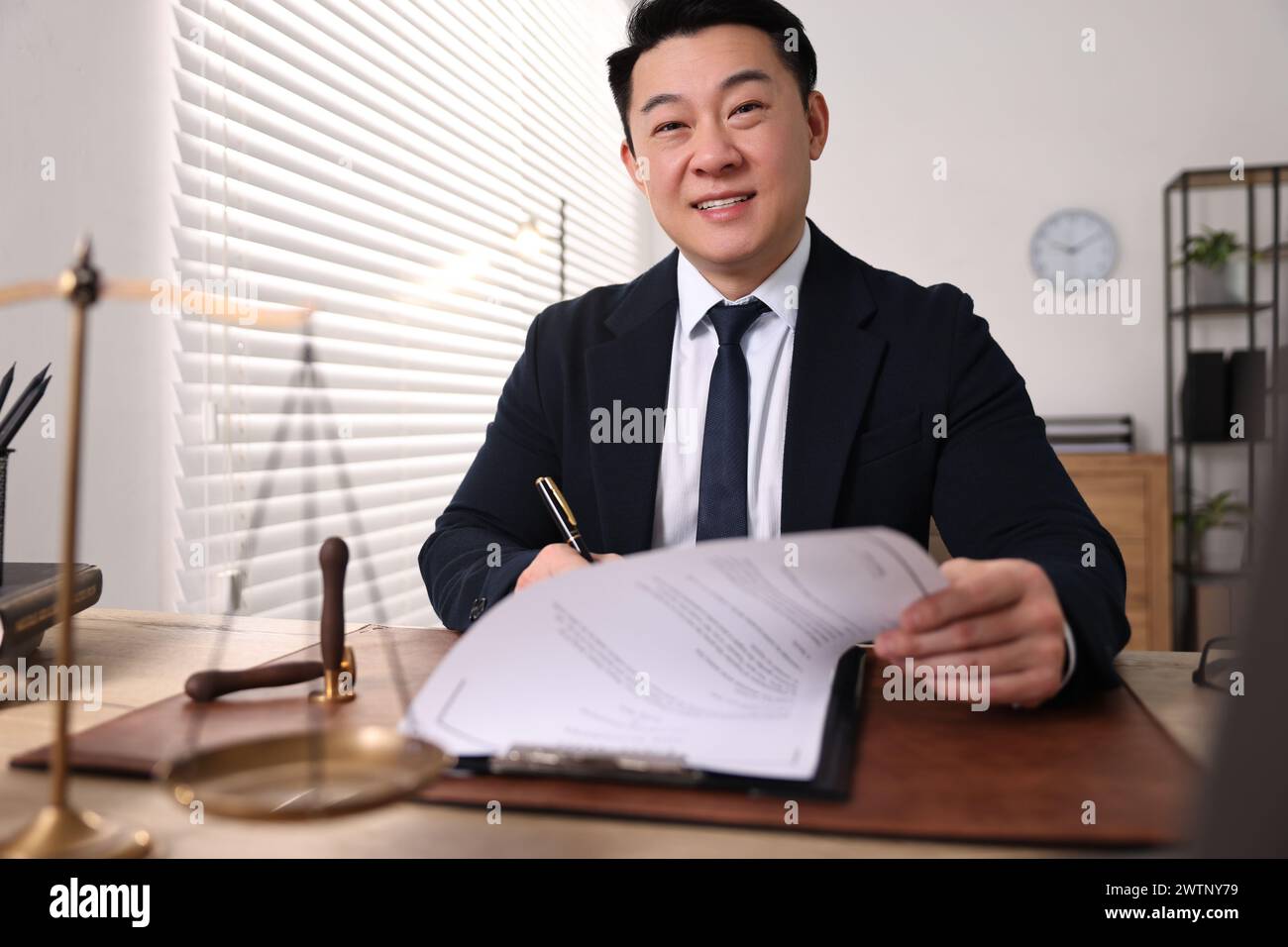 Asian man writing notes hi-res stock photography and images - Alamy