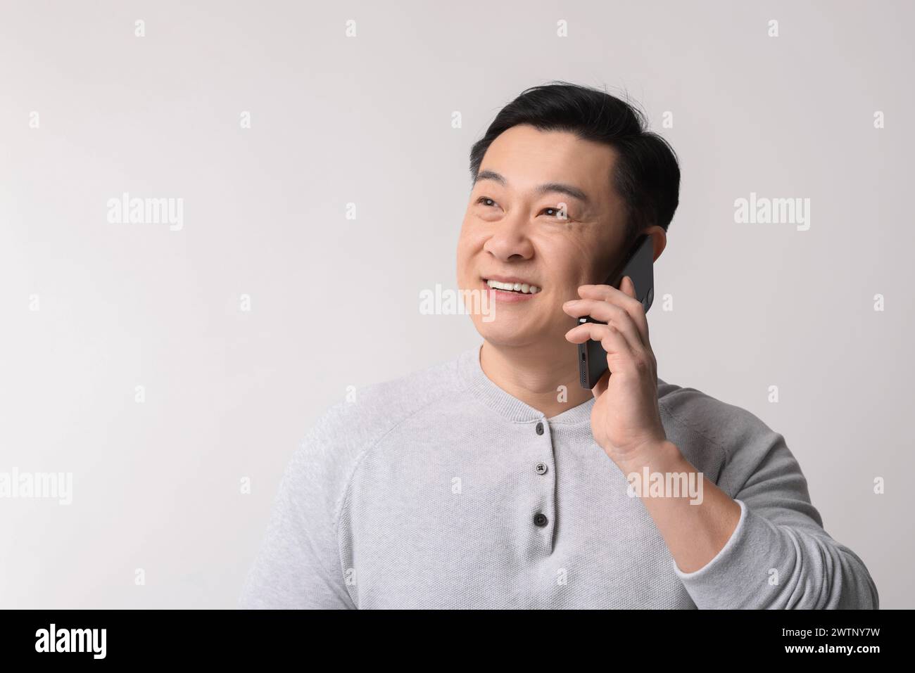 Happy delighted man talking hi-res stock photography and images - Alamy