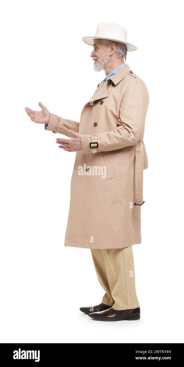 Senior man greeting someone on white background Stock Photo - Alamy