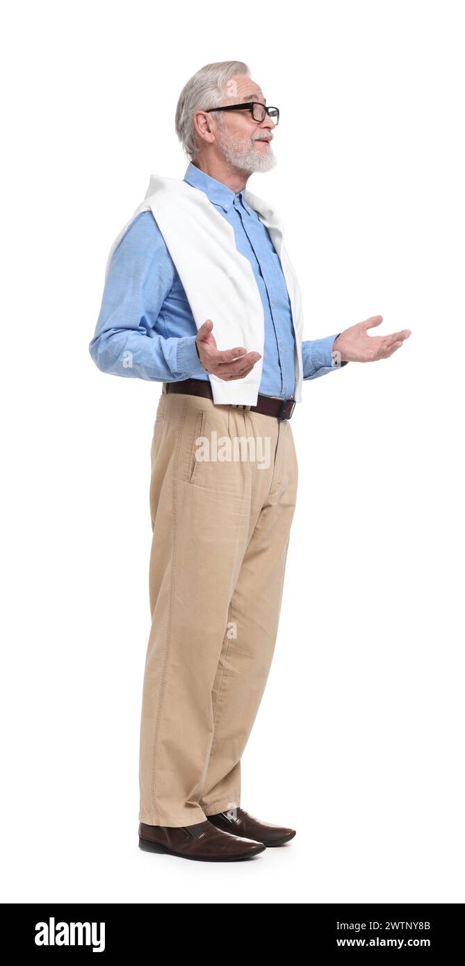 Senior man greeting someone on white background Stock Photo - Alamy
