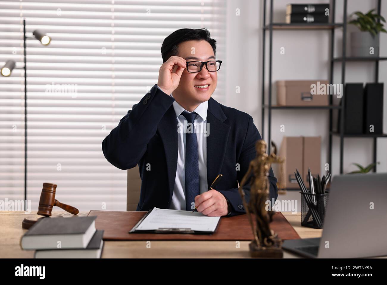 Asian man writing notes hi-res stock photography and images - Alamy