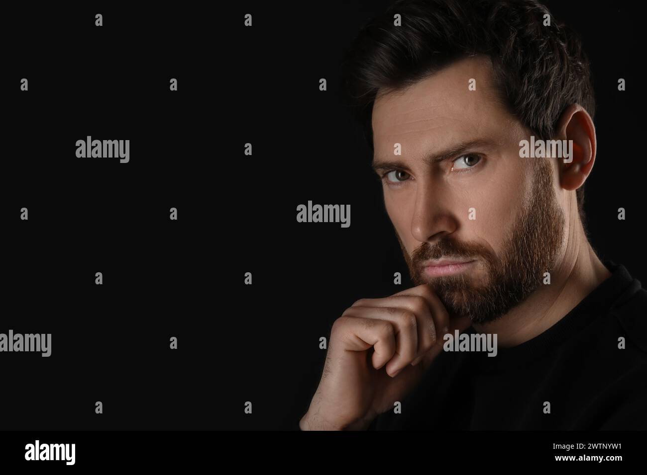 Evil eye. Man with scary eyes on black background, closeup and space ...