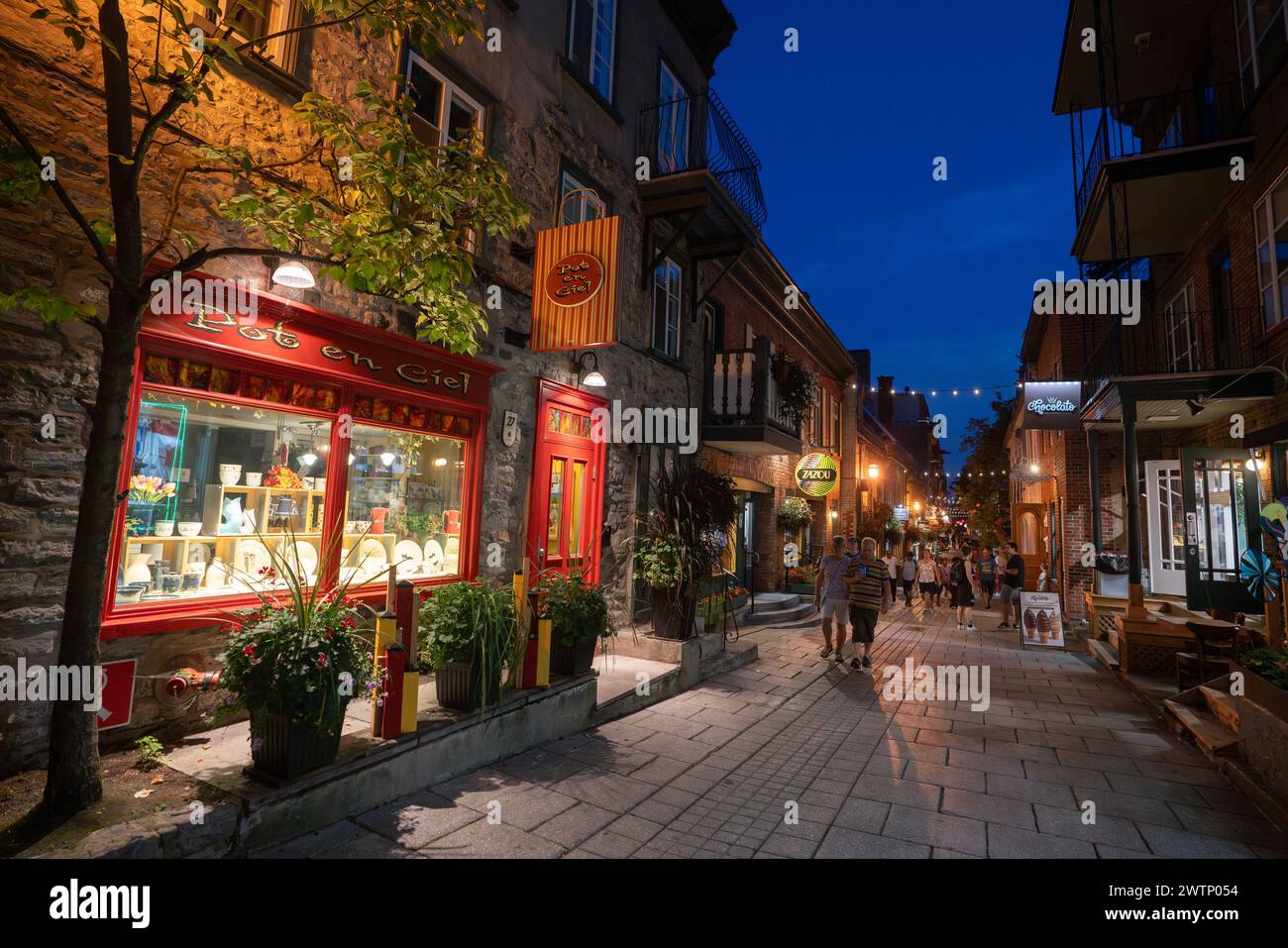 Old town Quebec city lit up at night with colorful lights Stock Photo ...