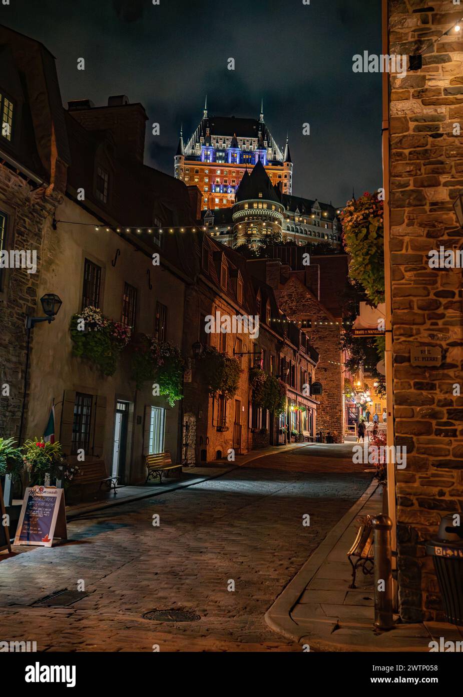 Old town Quebec city lit up at night with colorful lights Stock Photo ...