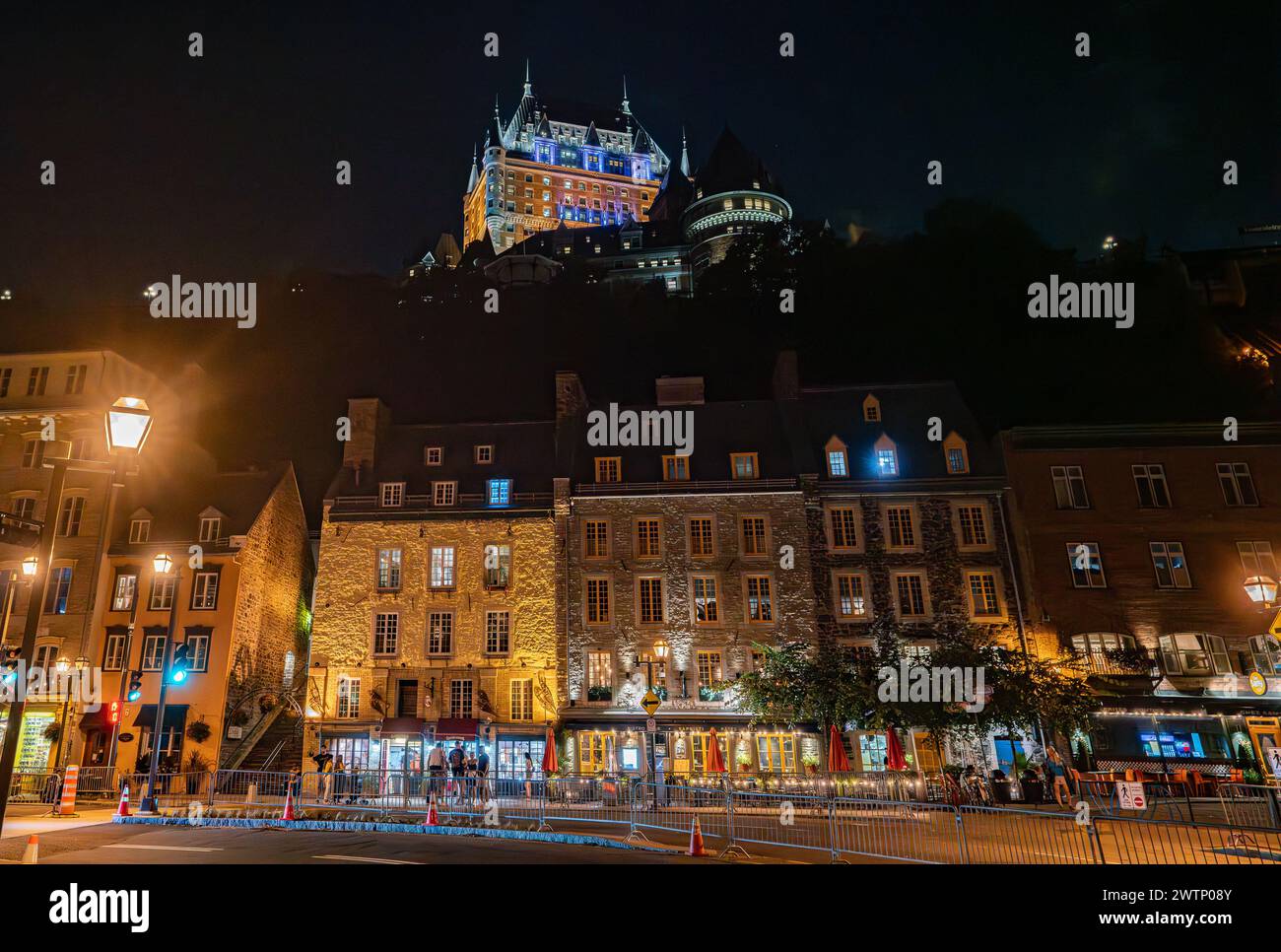 Old town Quebec city lit up at night with colorful lights Stock Photo ...