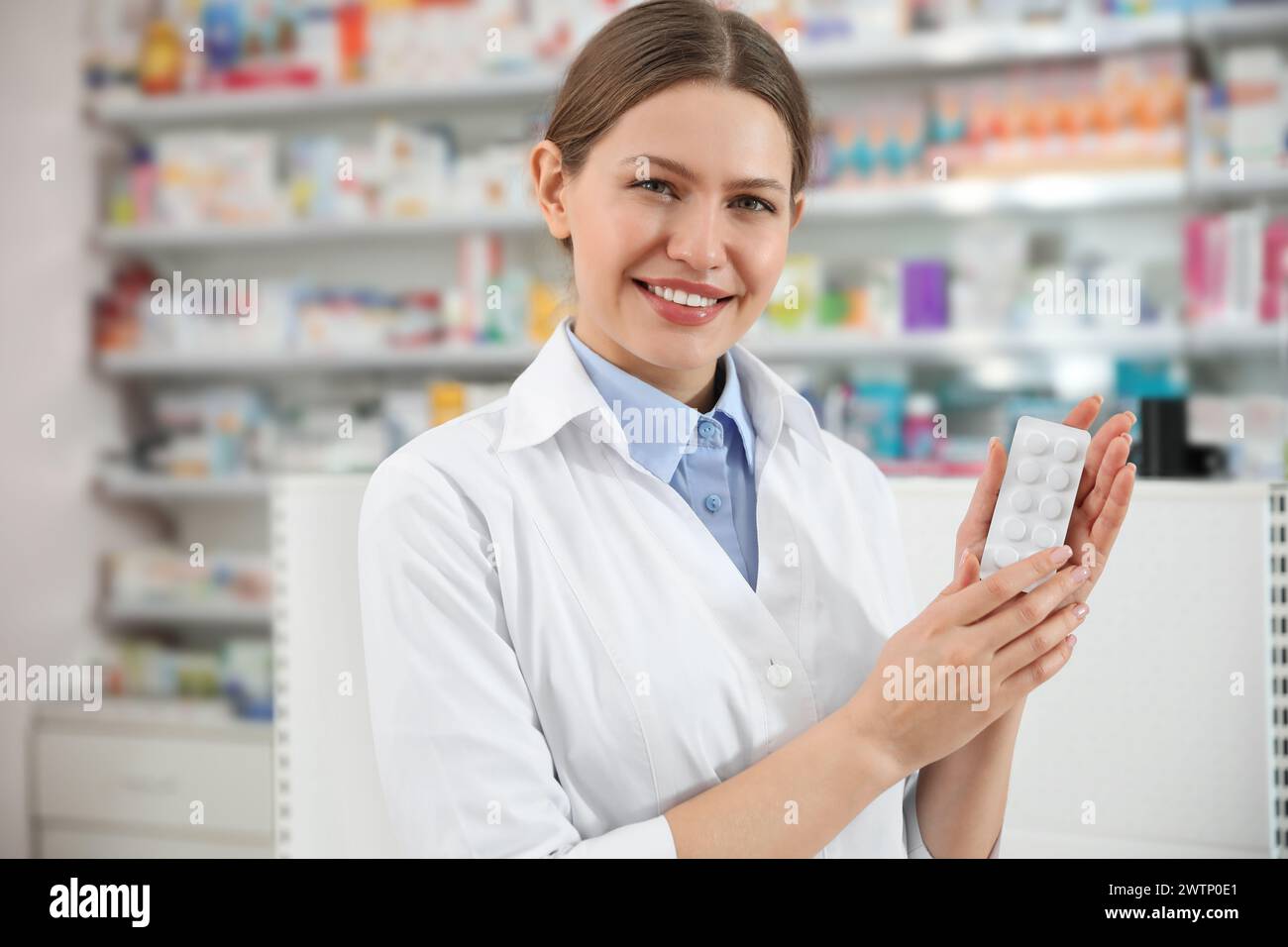 Smiling female pharmacist work hi-res stock photography and images - Alamy