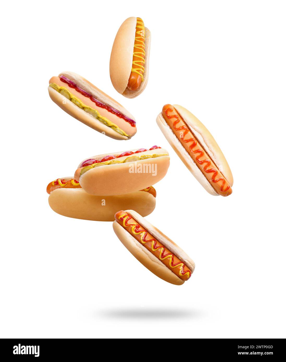 Tasty hot dogs with ketchup and mustard falling on white background ...