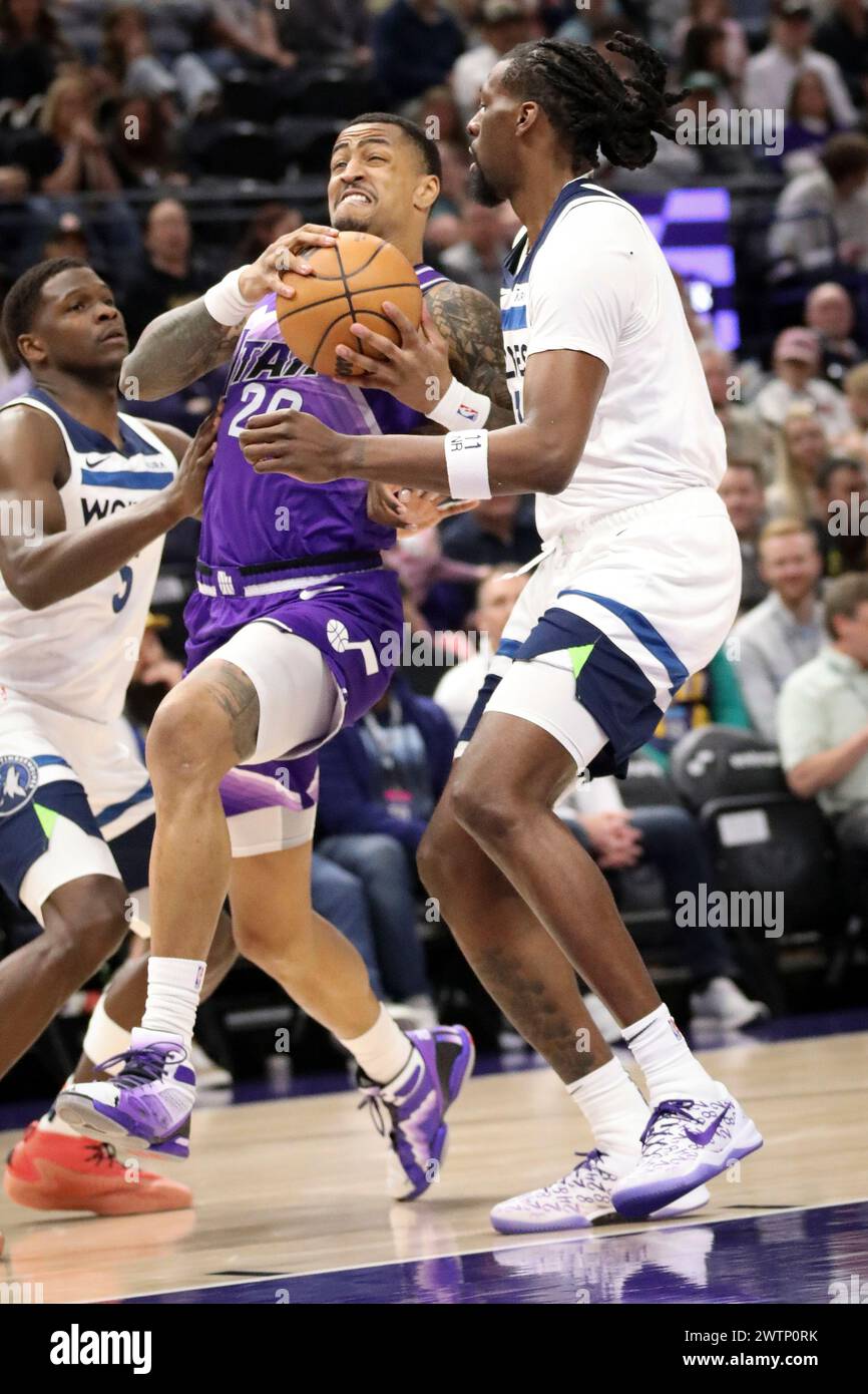 Utah Jazz forward John Collins, center, drives past Minnesota ...