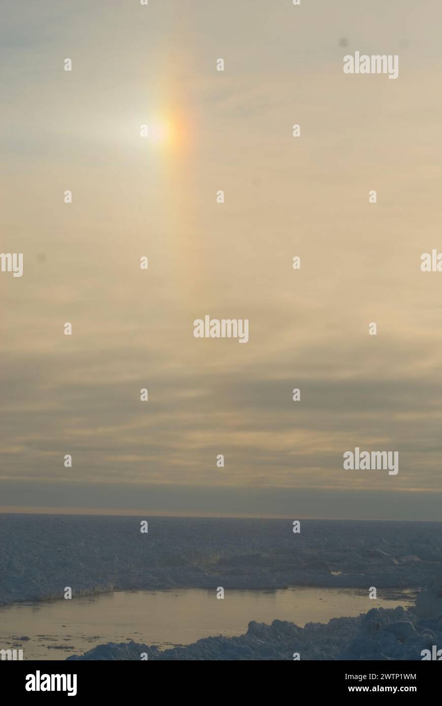 Seascape sun dog over open lead rough pack ice over the Chukchi sea in ...