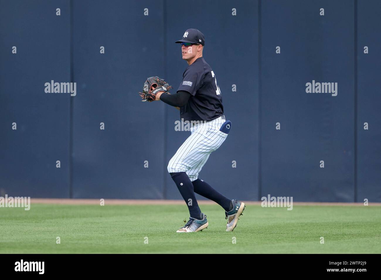 New York Yankees outfielder Brandon Lockridge (77) throws the ball in ...