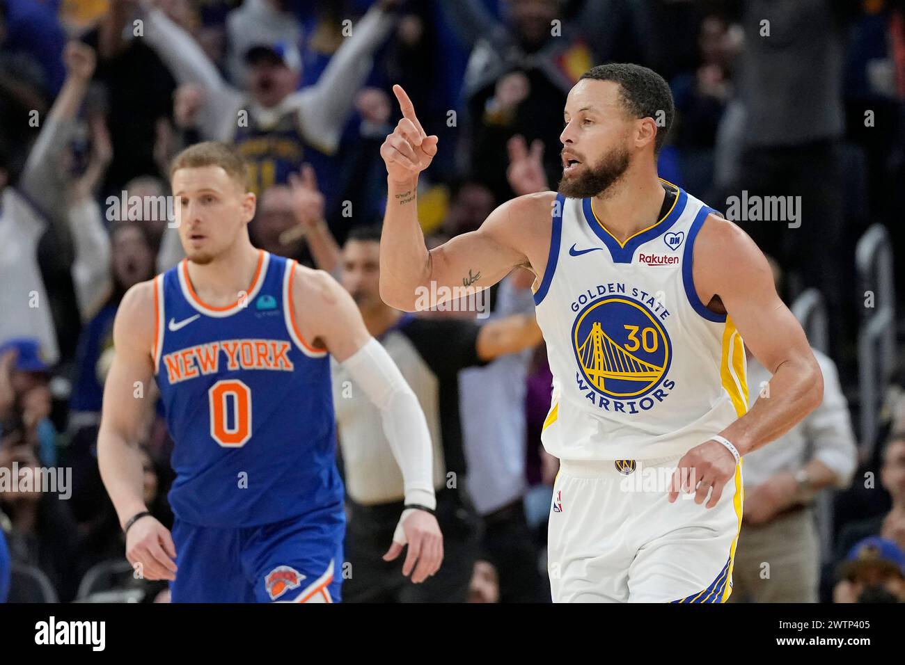 Golden State Warriors guard Stephen Curry (30) gestures after making a 3-point basket in front ...