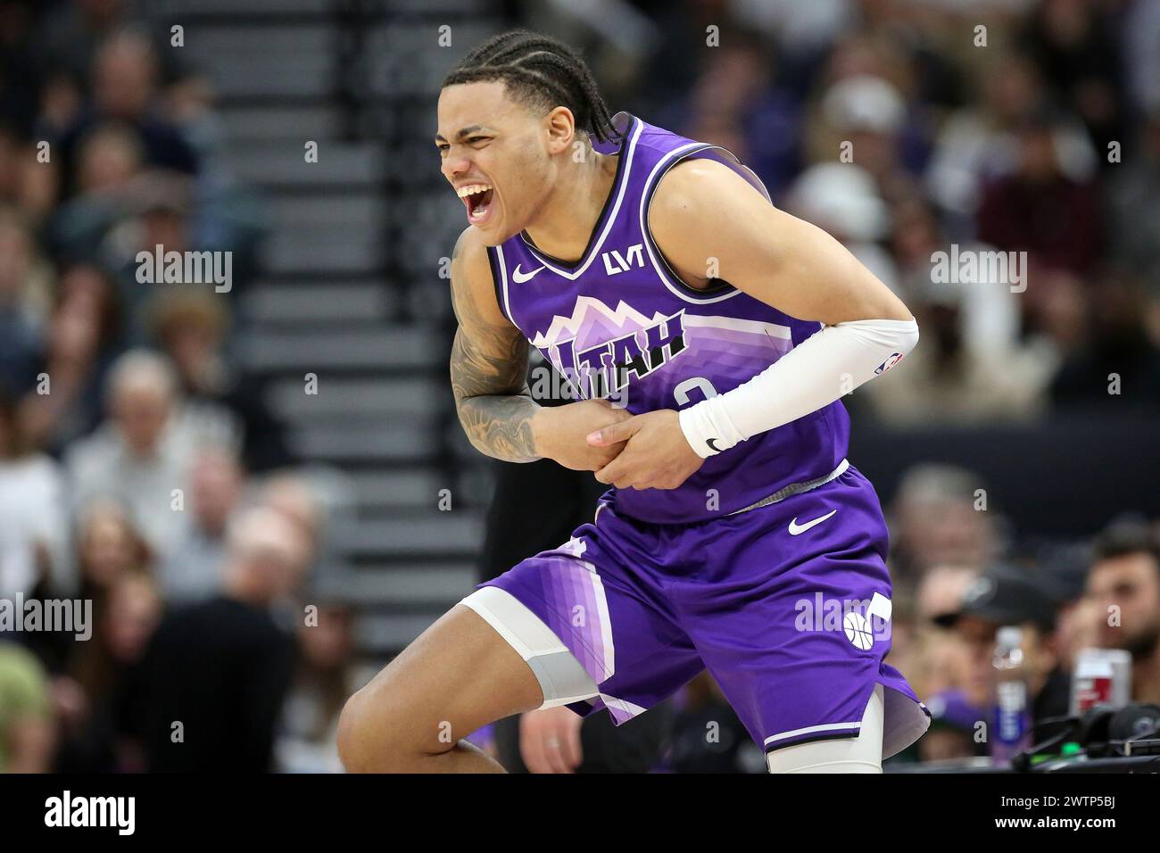 Utah Jazz guard Keyonte George grabs his hand and winces in pain after ...