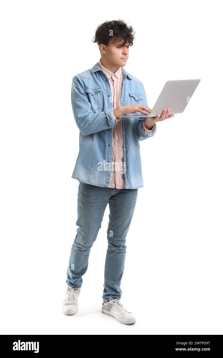 Male student using laptop on white background Stock Photo - Alamy