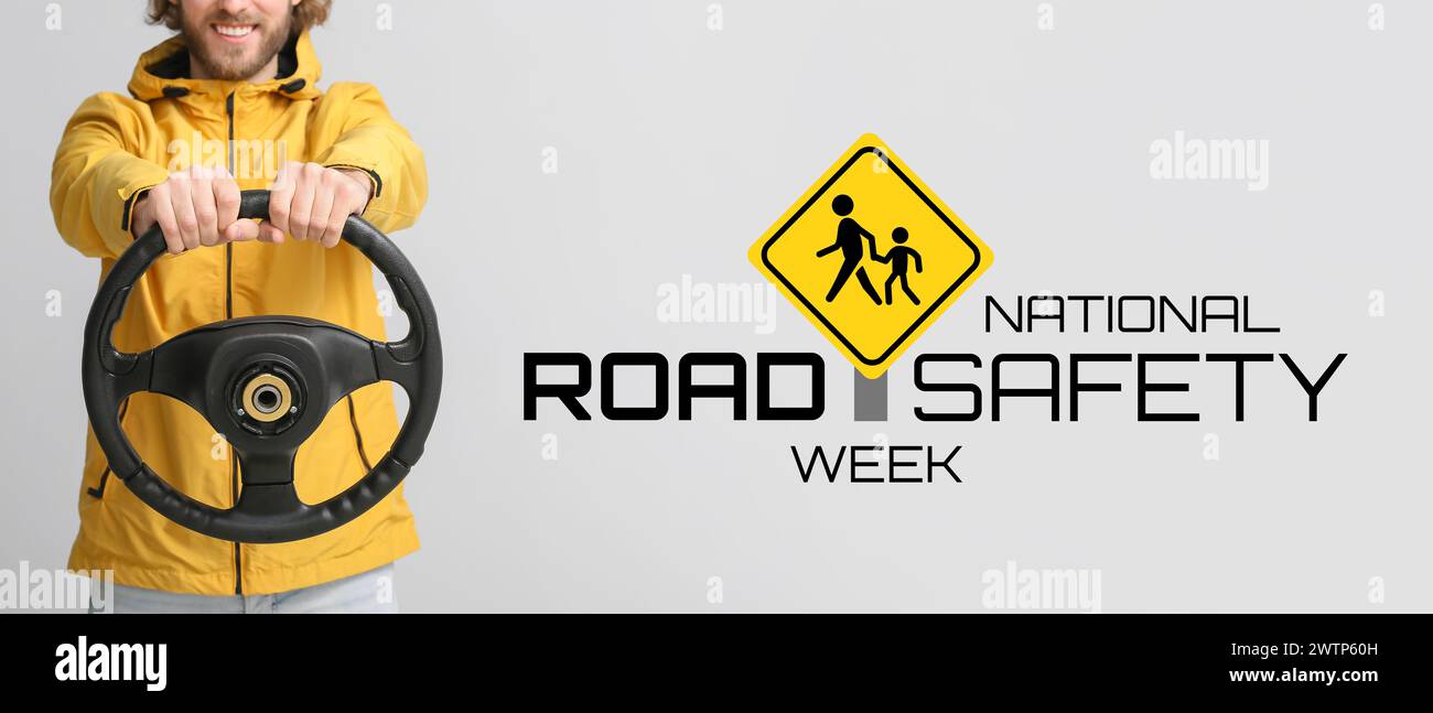 Man with steering wheel on light background. Banner for National Road ...