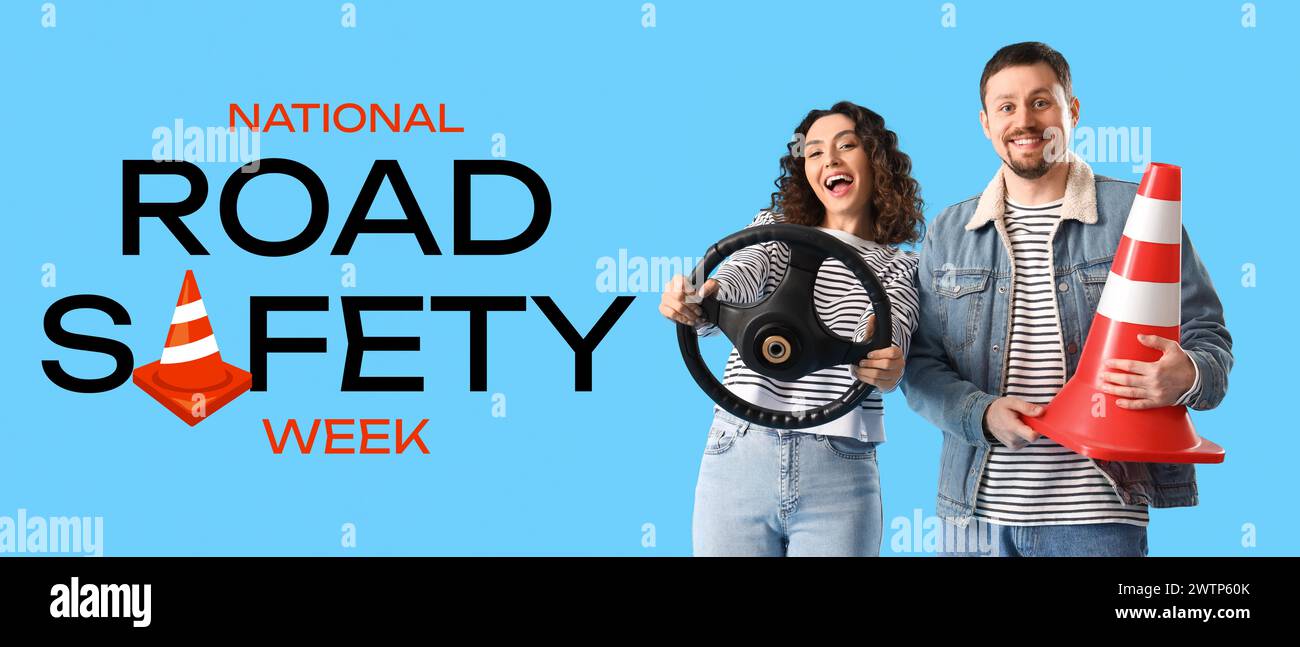 Young couple with steering wheel and traffic cone on light blue ...