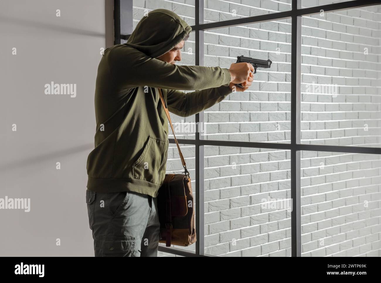 Male student with gun at university. Shooting problem concept Stock ...