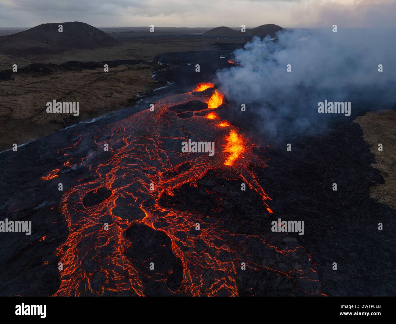 The eruptive fissure is still seen active with the lava flowing in ...