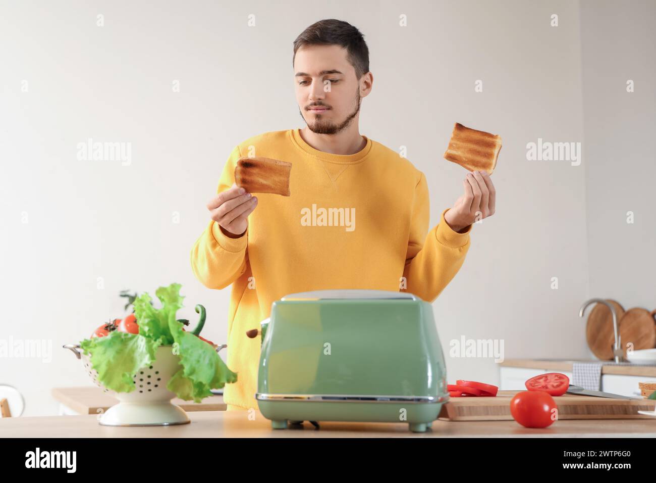 Man preparing tasty toasts hi-res stock photography and images - Alamy