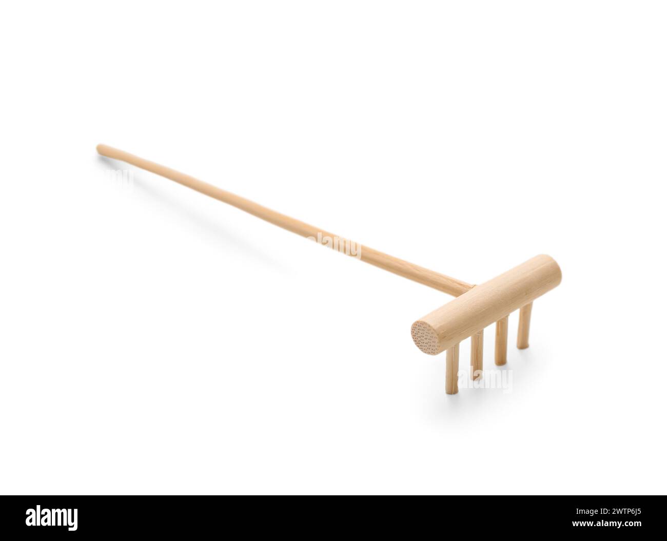 Small wooden rake for Japanese rock garden on white background Stock ...