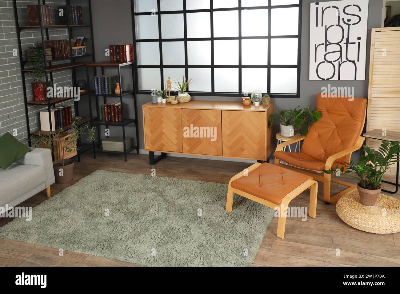 Interior of living room with armchair, drawers and bookshelf Stock ...
