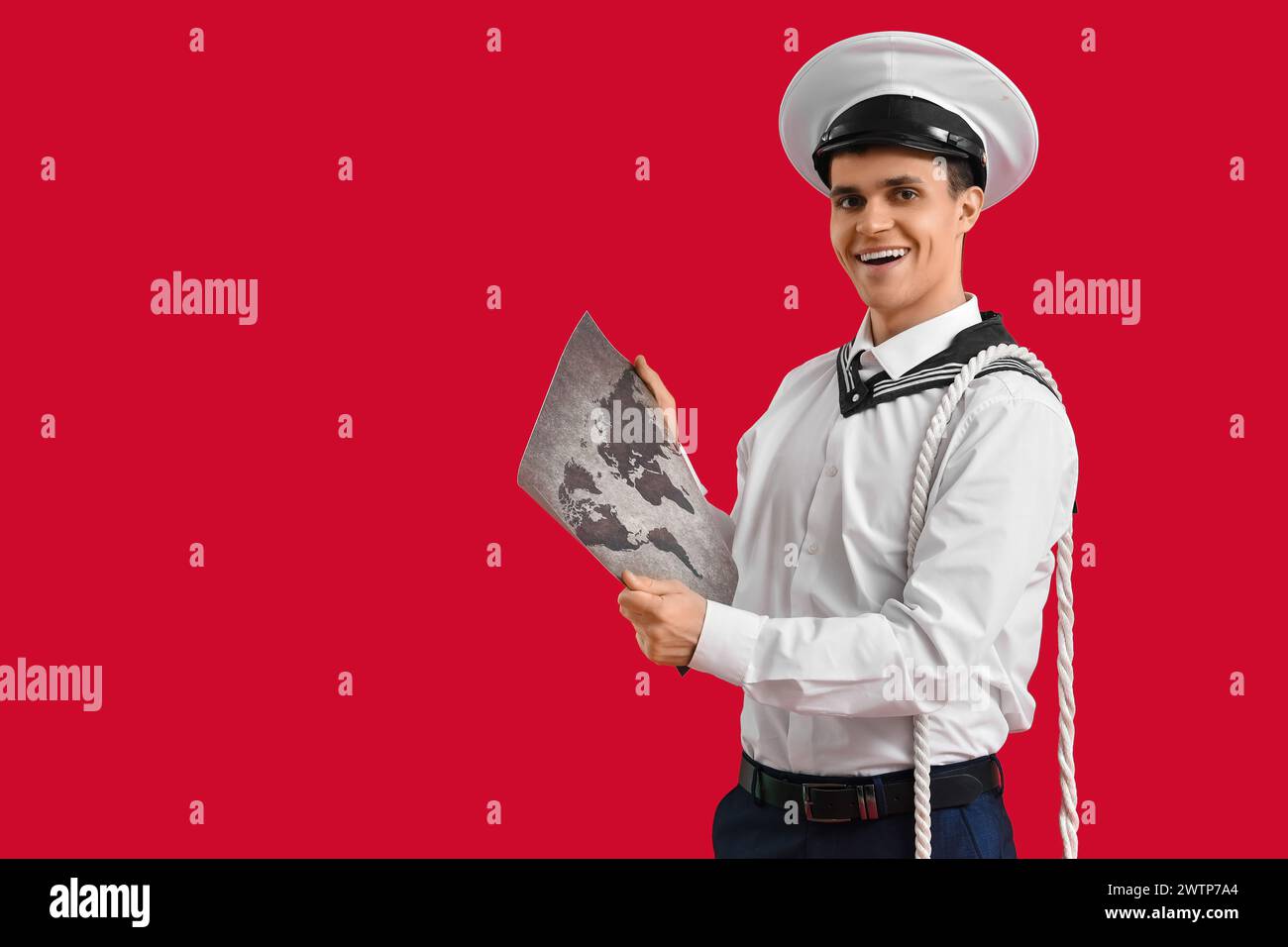 Young sailor with rope and world map on red background Stock Photo - Alamy