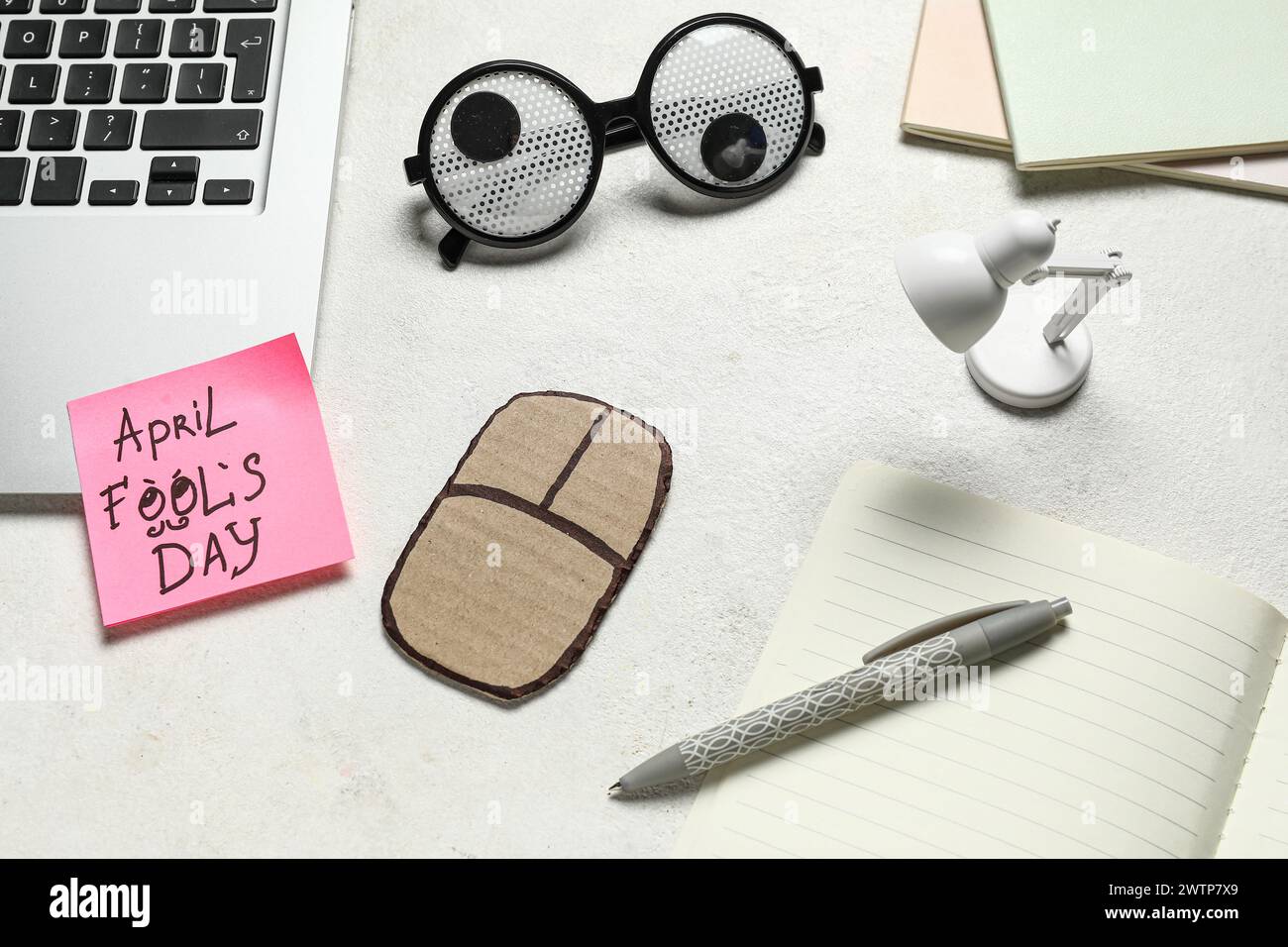 Carton mouse, pen, funny glasses and sticky note on white background ...