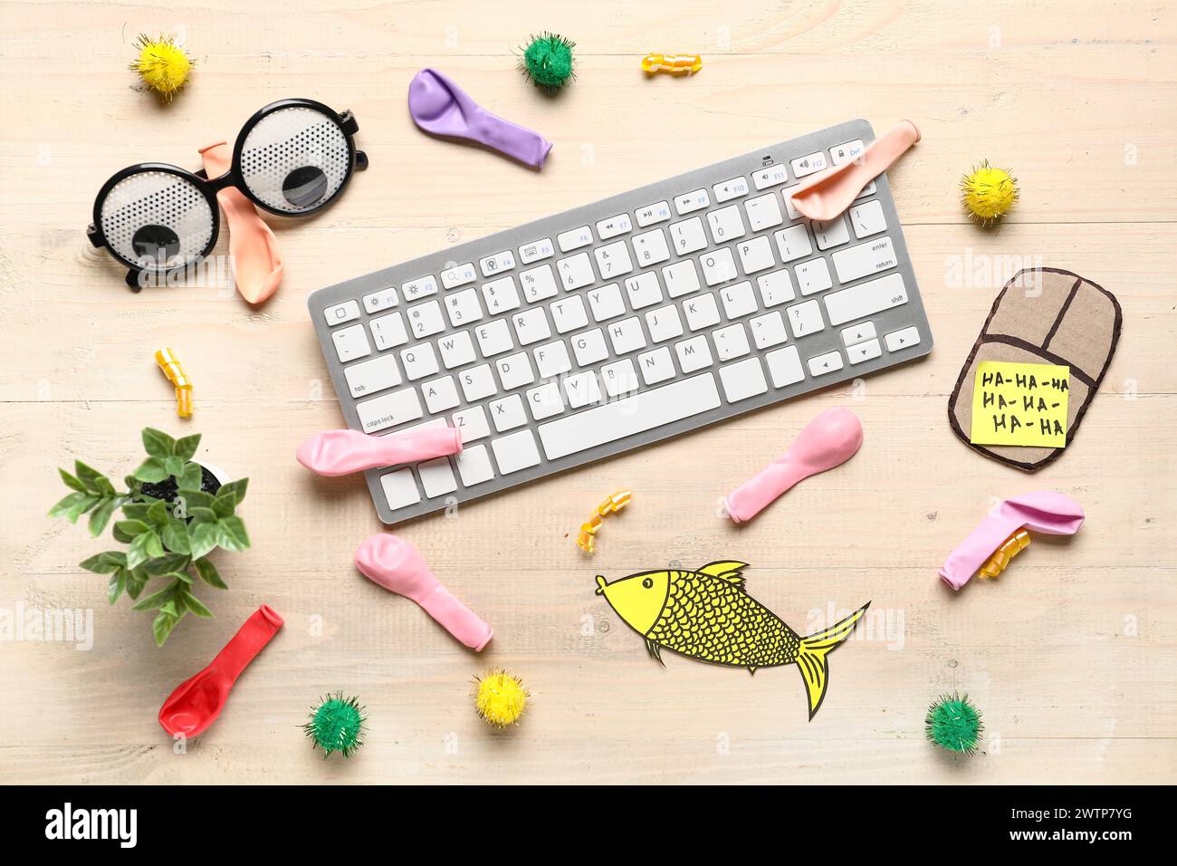 Funny glasses, computer keyboard and carton mouse on wooden background ...