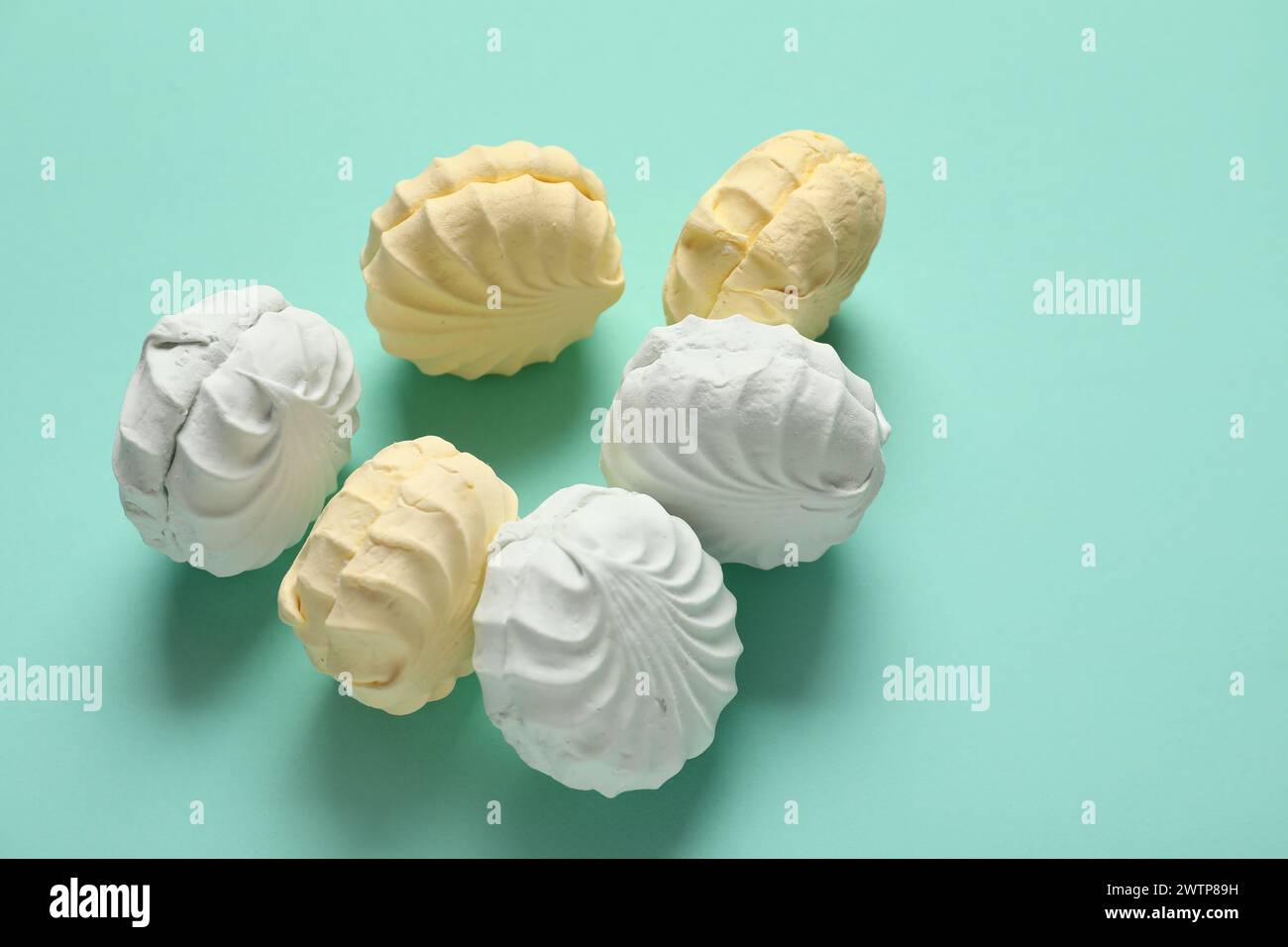Many sweet zephyr on turquoise background Stock Photo - Alamy
