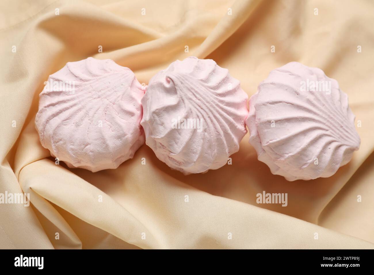 Sweet zephyr on fabric background Stock Photo - Alamy