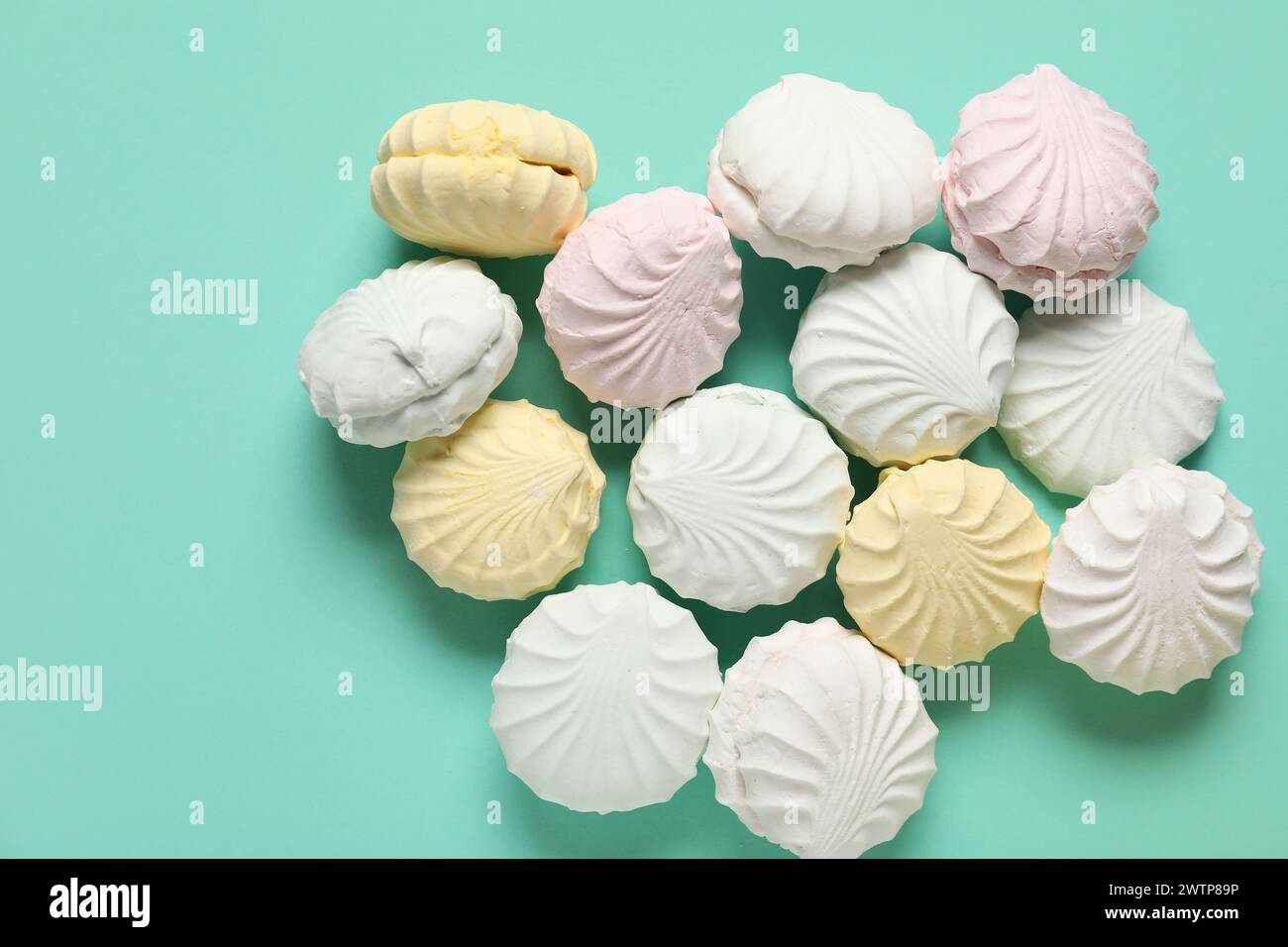 Many sweet zephyr on turquoise background Stock Photo - Alamy