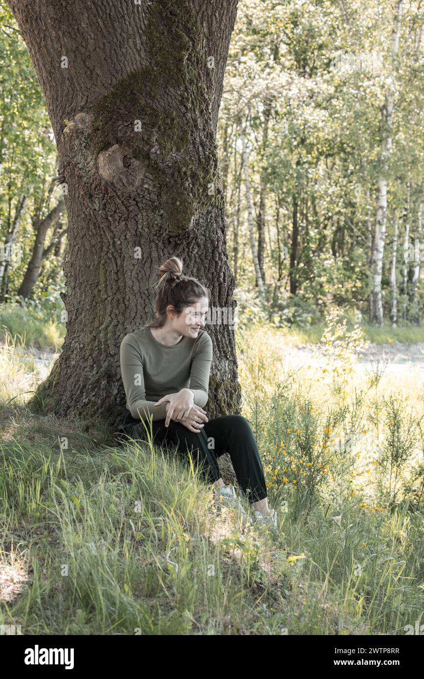 Seated under tree hi-res stock photography and images - Alamy
