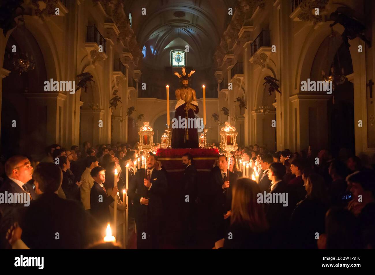 Malaga, Spain. 18th Mar, 2024. The statue of Christ is being carried by ...