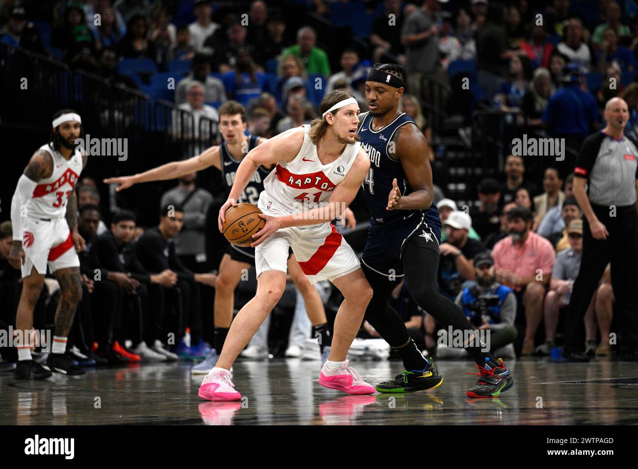 Toronto Raptors forward Kelly Olynyk (41) is defended by Orlando Magic ...