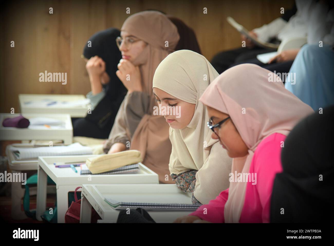 Young students wearing Islamic veils attend an Arabic class lesson at ...