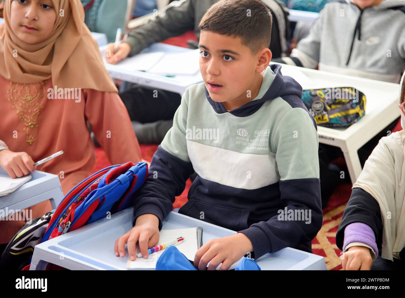 A Muslim child is seen during an Arabic class lesson at the Islamic ...